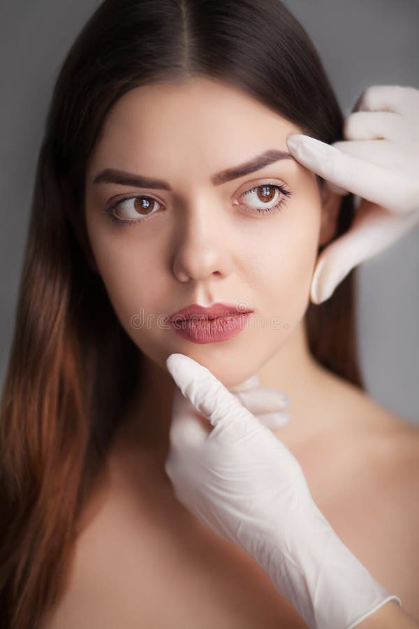 Beautiful Model Applying Cosmetic Cream Treatment on Her Face Stock ...