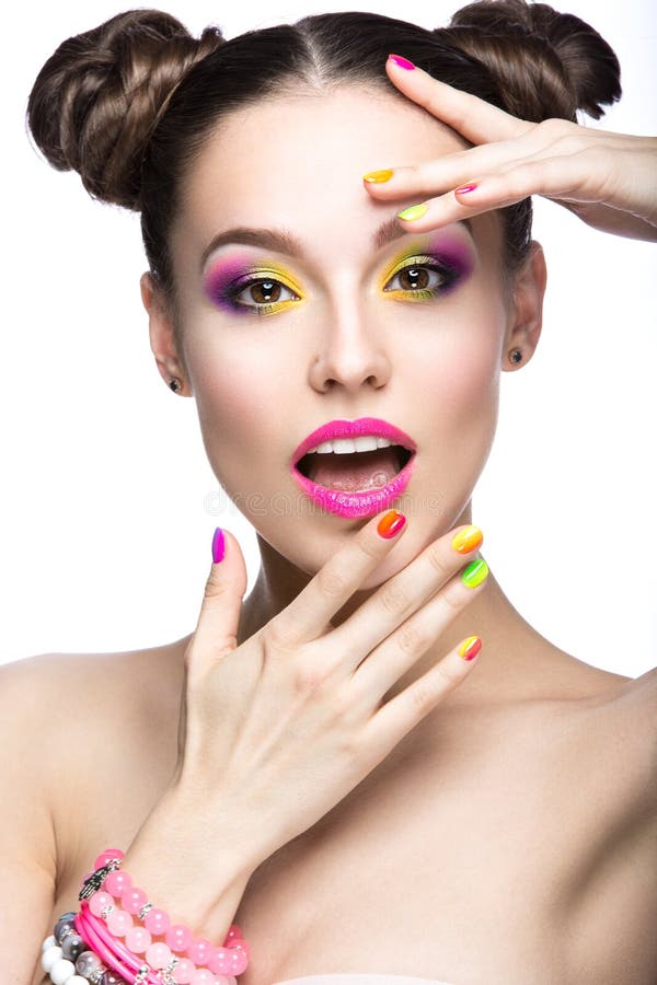 Beautiful Model Girl With Bright Colored Makeup And Nail Polish In The