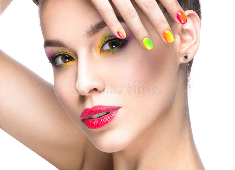 Beautiful Model Girl With Bright Colored Makeup And Nail Polish In The