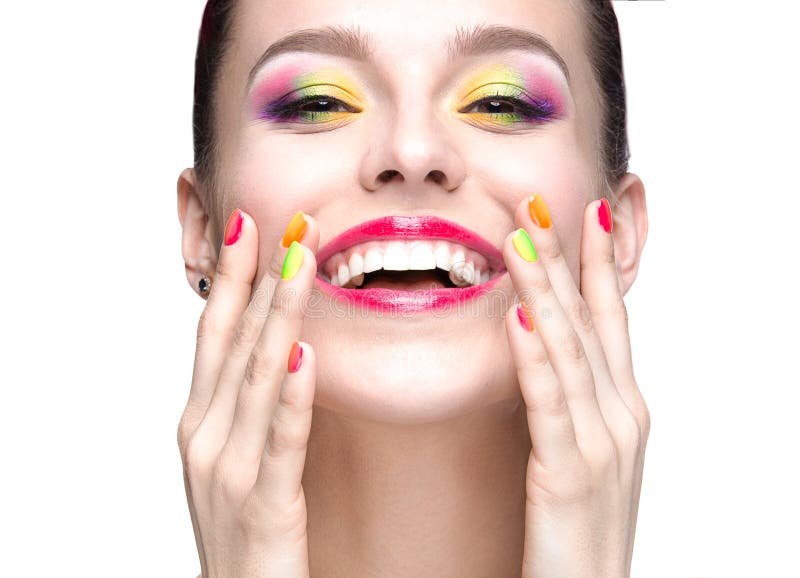 Beautiful Model Girl With Bright Colored Makeup And Nail Polish In The