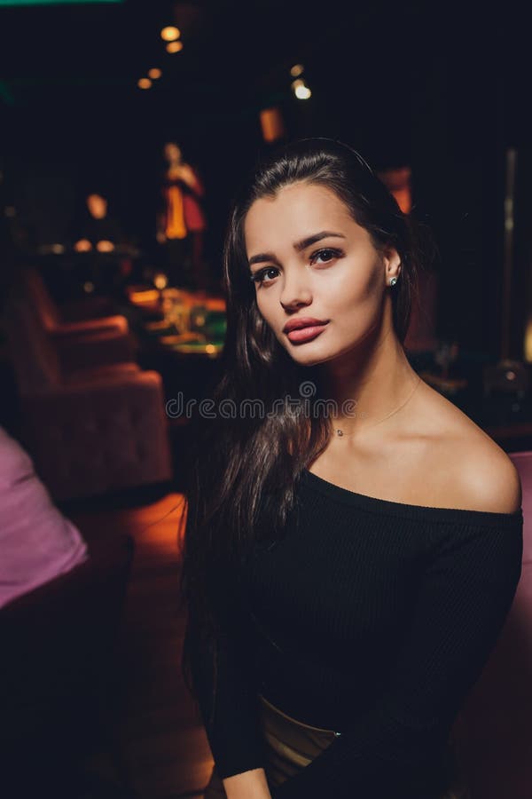 Beautiful Model are Seating in the Dark Room. Stock Image - Image of ...