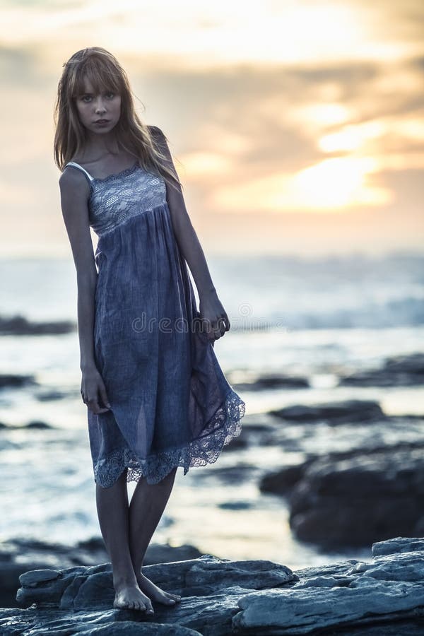 Beautiful Model Standing on Rocks by the Sea Stock Image - Image of ...