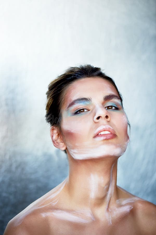Beautiful Model. Stands in Profile, Makeup with Paint Strokes on the ...