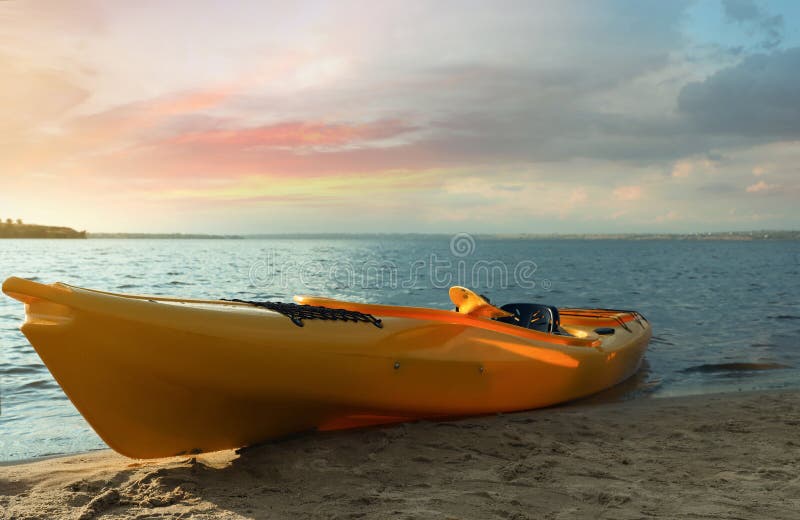 Beautiful Modern Yellow Kayak on Beach Near River Stock Photo - Image ...