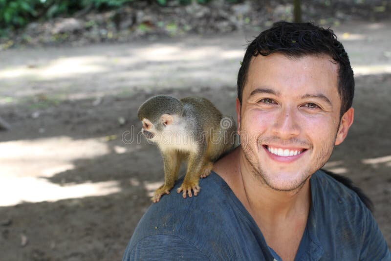 Beautiful Monkey Interacting with a Huma Stock Image - Image of ...