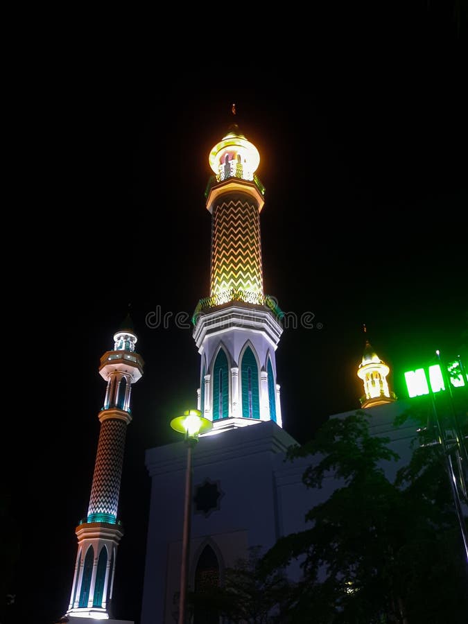 Beautiful Mosque Tower Decorated with Sparkling Lights at Night Stock ...