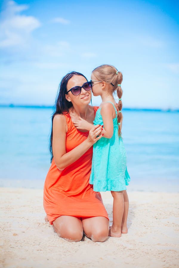 Beautiful Mother And Daughter At The Beach Enjoying Summer Vacation