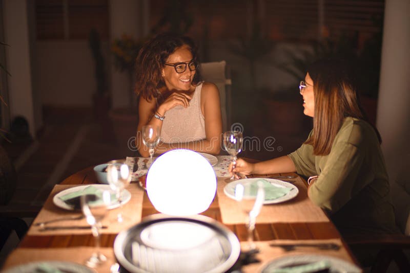 Beautiful Mother and Daughter on Dinner Smiling at Terrace Stock Photo ...