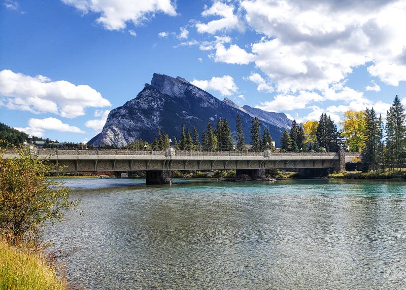 Mountain Behind Bridge and Bow River in Alberta Stock Image - Image of ...