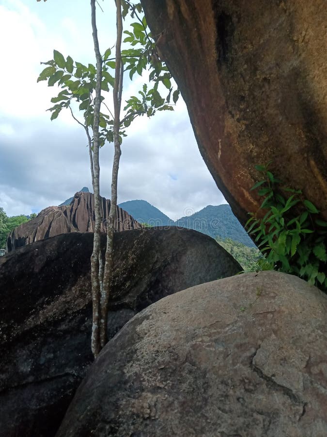 The Beautiful Mountain Behind the Rock and Tree Stock Photo - Image of ...