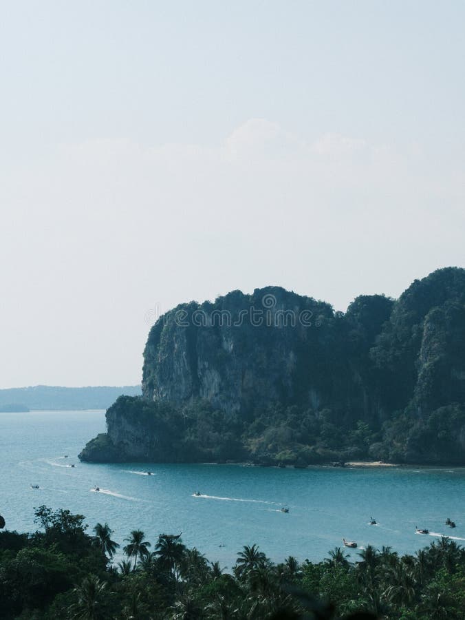 A Beautiful Mountain Range with a Blue Ocean in the Background Stock ...