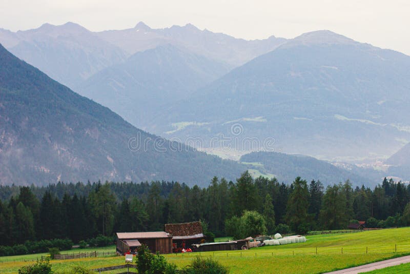 Beautiful Mountainous Country Scenery with a Farm and Green Fields ...