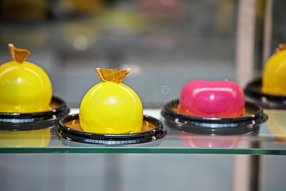 Beautiful Multi-colored Round Muos Cakes on Display. Stock Photo ...