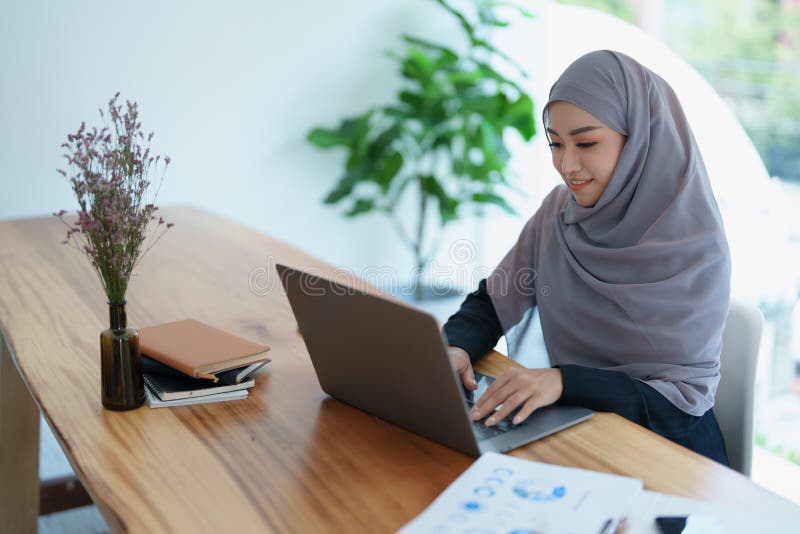 Eautiful Muslim Woman Using Computer and Documents Working in Office ...