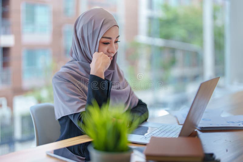 Eautiful Muslim Woman Using Computer and Documents Working in Office ...