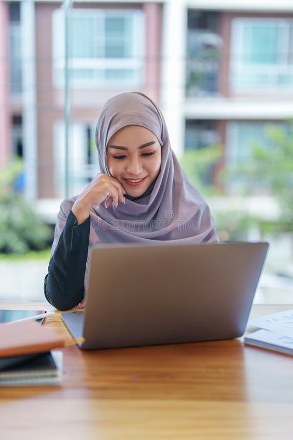 Eautiful Muslim Woman Using Computer and Documents Working in Office ...