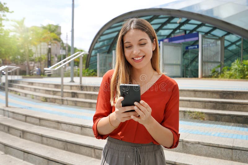 Beautiful Native Digital Girl Using Mobile Phone in the City Stock ...