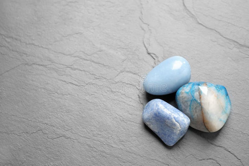 Beautiful Natural Blue Gemstones on Grey Table Stock Photo - Image of ...