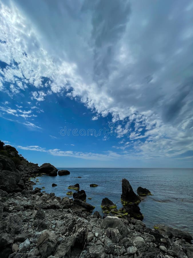 Beautiful Nature on the Sea Stone Beach with Sky with Clouds Stock ...
