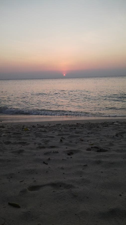 Sunset beach view stock photo. Image of sunset, creation - 115284202