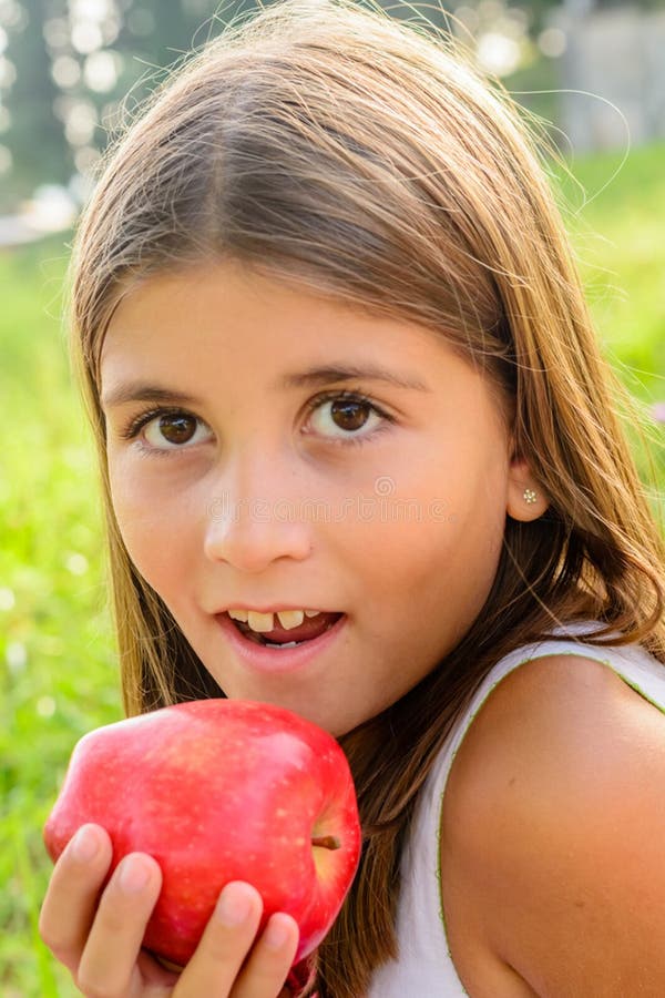 Beautiful Nine Year Old Girl Eating Apple Stock Photo - Image of sweet ...