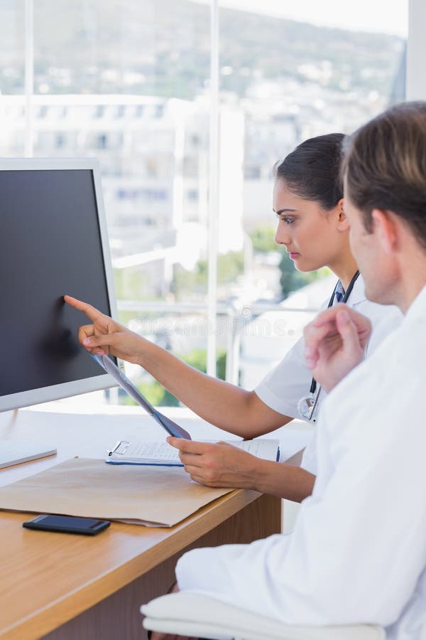 Doctor Showing the Screen of a Computer To a Colleague Stock Photo ...
