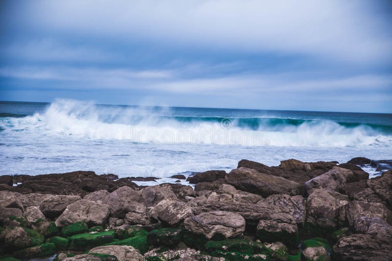 Beautiful Ocean Waves Hitting the Rocks Under the Cloudy Sky - Great ...