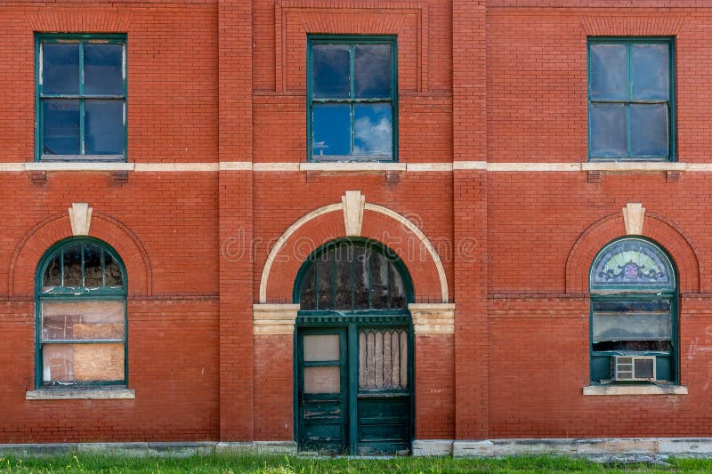 Old Brick Building with Vintage Doors and Windows Stock Image - Image ...