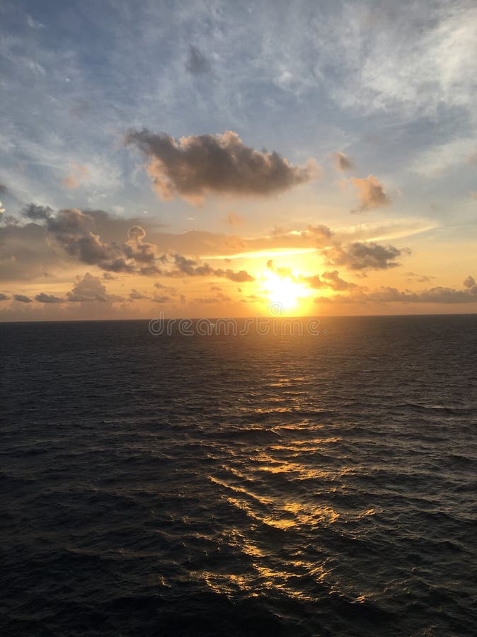 The Sunset Over the Open Ocean Stock Image - Image of open, clous ...