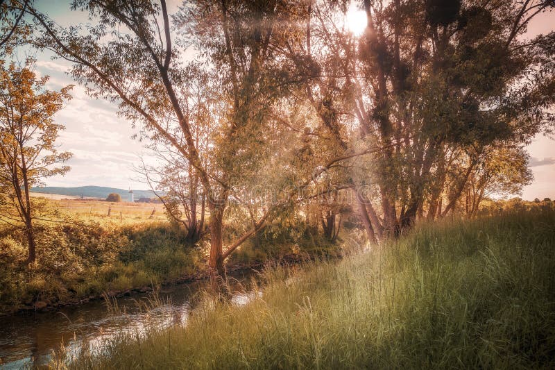 A Beautiful Orange Sunset on a Small River Stock Image - Image of ...