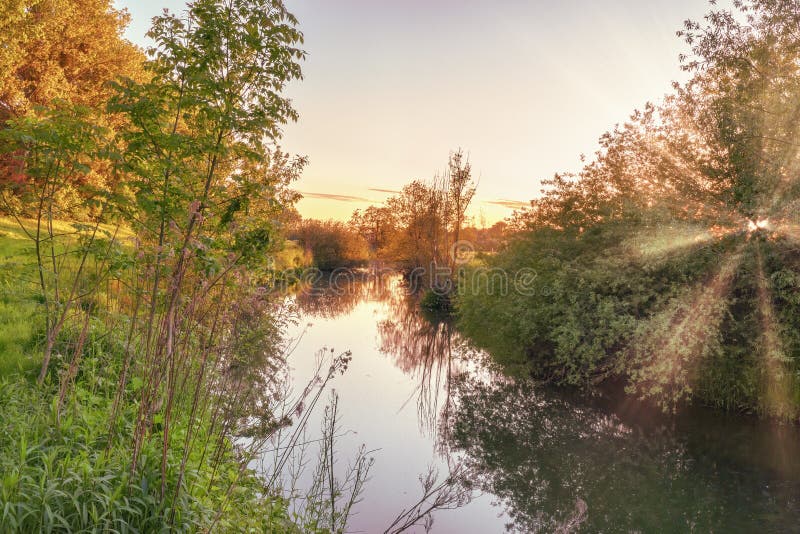 A Beautiful Orange Sunset on a Small River in the Evening Stock Photo ...