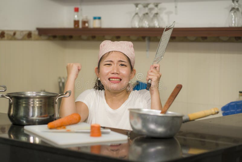 Beautiful Overwhelmed And Stressed Korean Girl Working In Kitchen