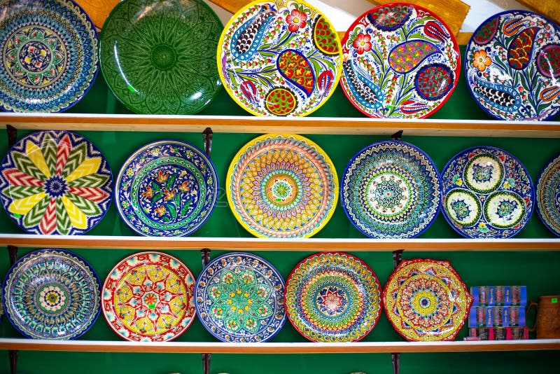 Beautiful Painted Ceramic Tableware on the Rack. Creativity of the ...