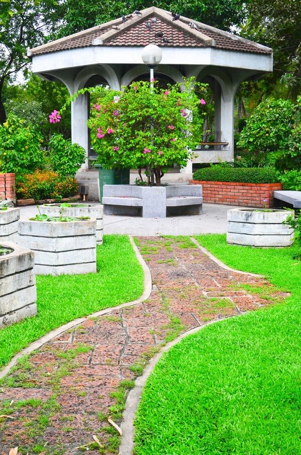 Garden Landscape Design with Pathway Intersecting Bright Green Lawns ...