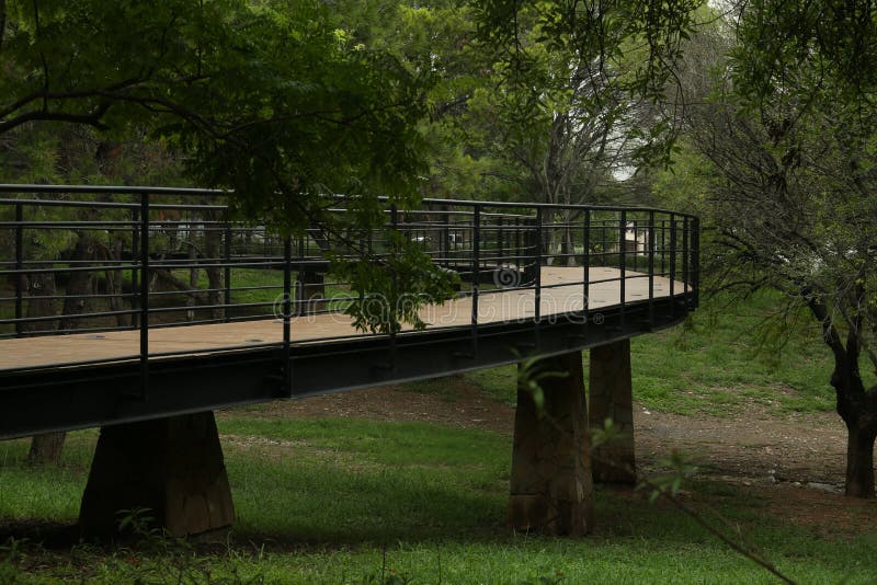 Beautiful Pathway with Metal Handrails in Park Near Trees Stock Photo ...
