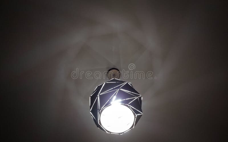 A Beautiful Pattern of Light Reflections from Hanging Lamp on White ...