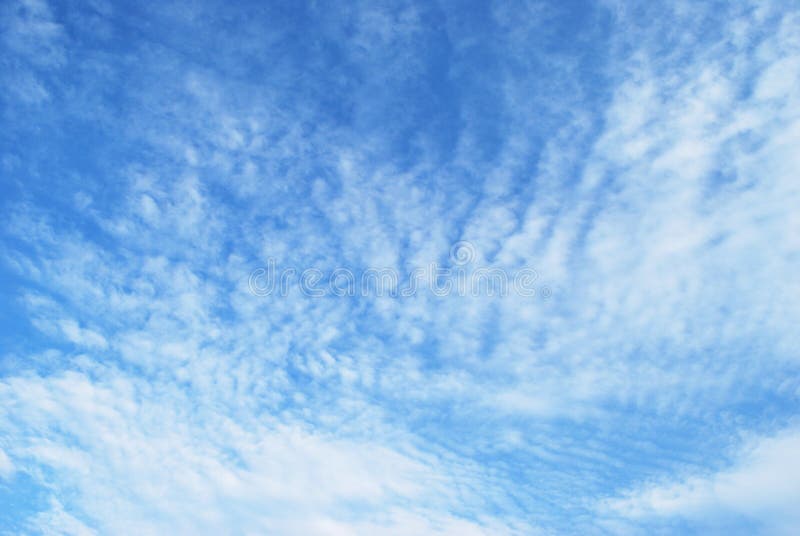 Delicate White Clouds Adorn the Bright Blue Sky Stock Image - Image of ...