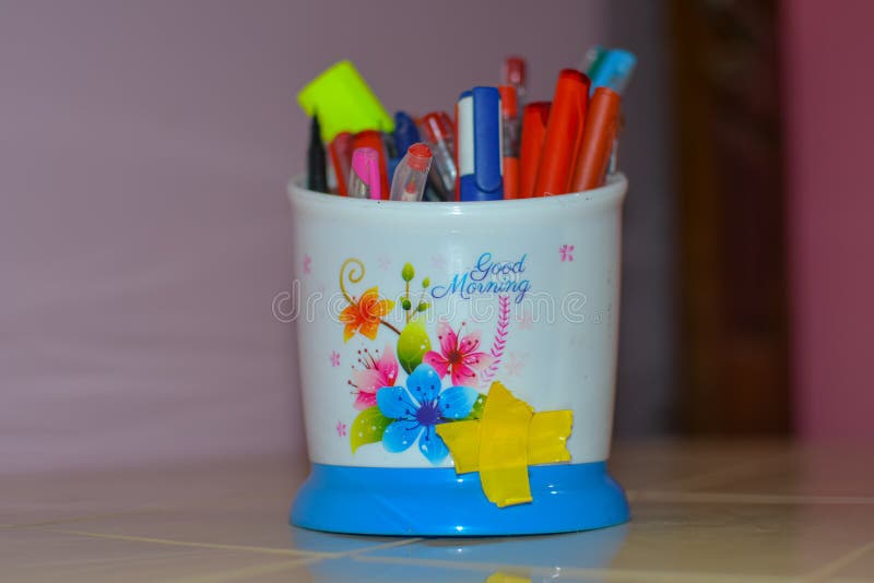 Beautiful Pen Holder on the Table. Stock Image - Image of lighting ...