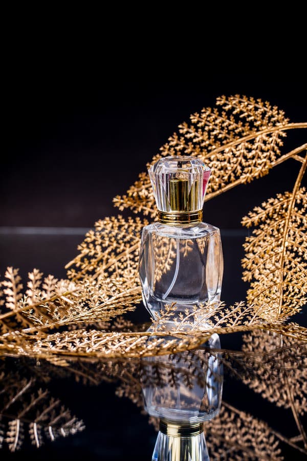 Beautiful Perfume Bottle and Golden Leaves Stock Photo - Image of ...