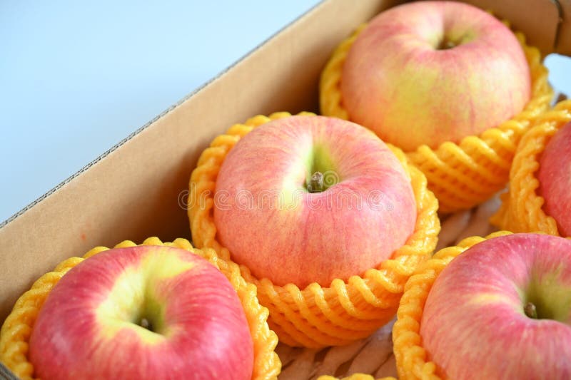 Beautiful Pink Apple in the Box on Blue Background Stock Photo - Image ...