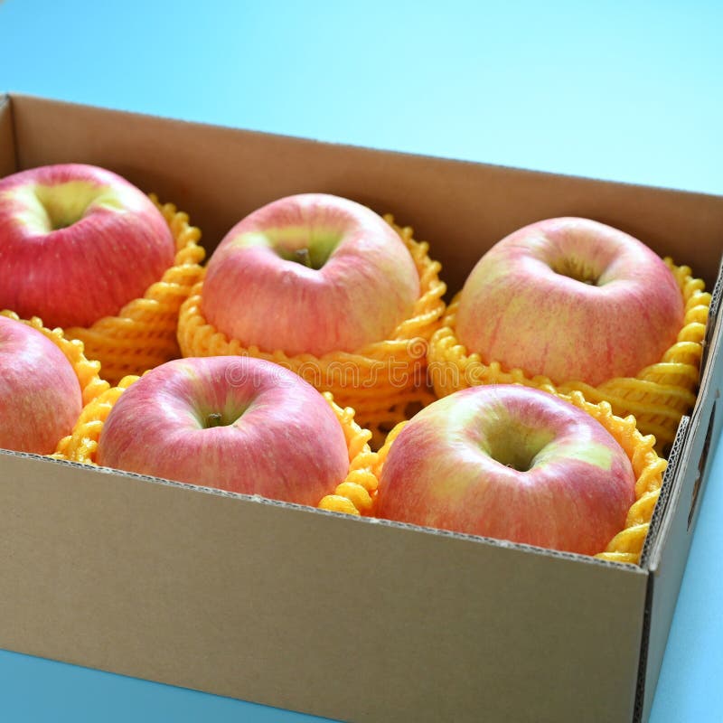 Beautiful Pink Apple in the Box on Blue Background Stock Image - Image ...
