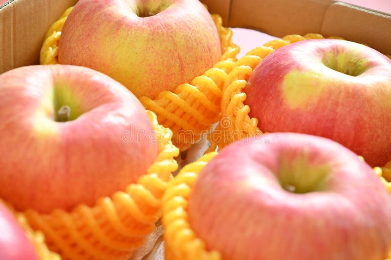 Beautiful Pink Apple in Yellow Wrap Bubble, Healthy Fruit in the Box ...