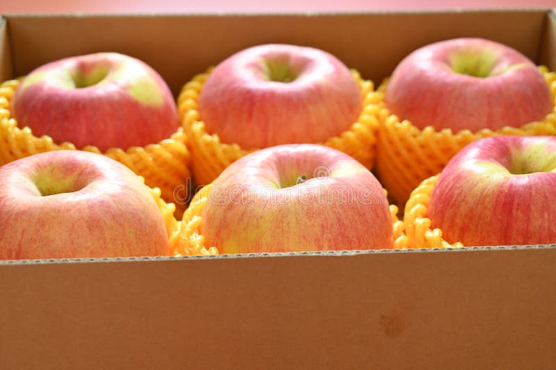 Beautiful Pink Apple in Yellow Wrap Bubble, Healthy Fruit in the Box ...