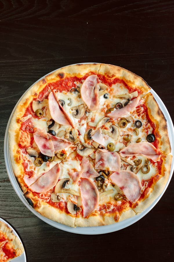 Beautiful Pizza with a Ham on a Table Stock Photo - Image of table ...