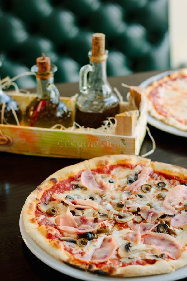 Beautiful Pizza with a Ham on a Table Stock Image - Image of happy ...
