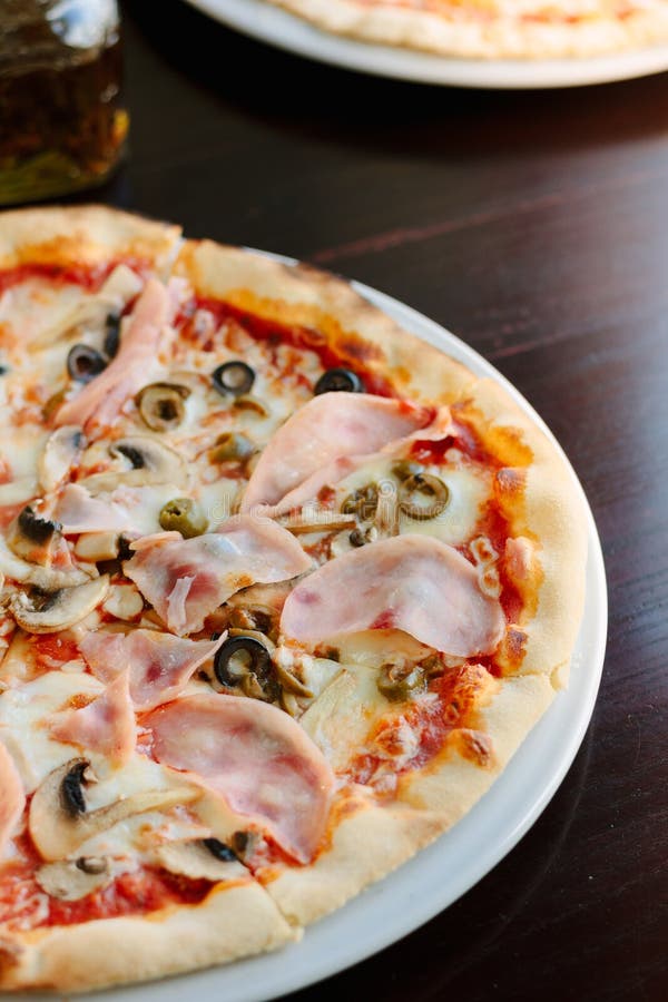 Beautiful Pizza with a Ham on a Table Stock Image - Image of kitchen ...