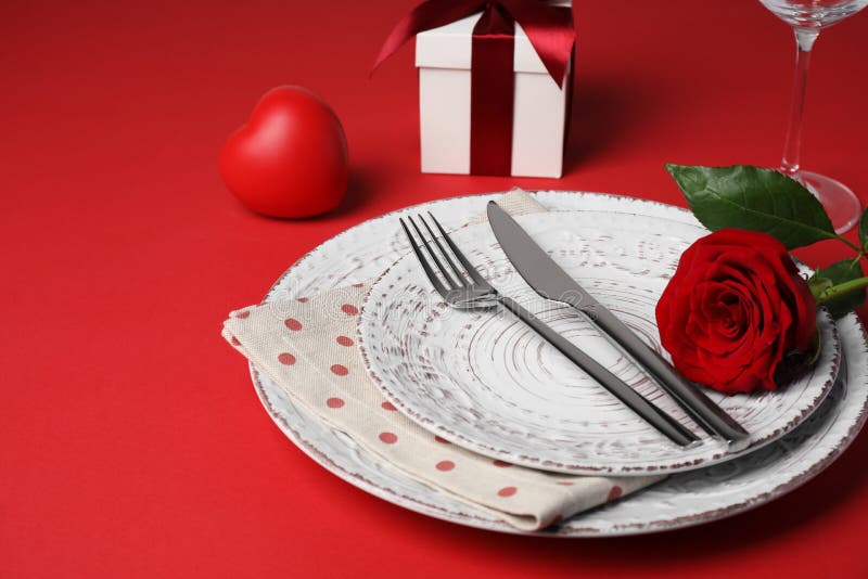 Beautiful Place Setting with Dishware, Gift and Rose for Romantic ...