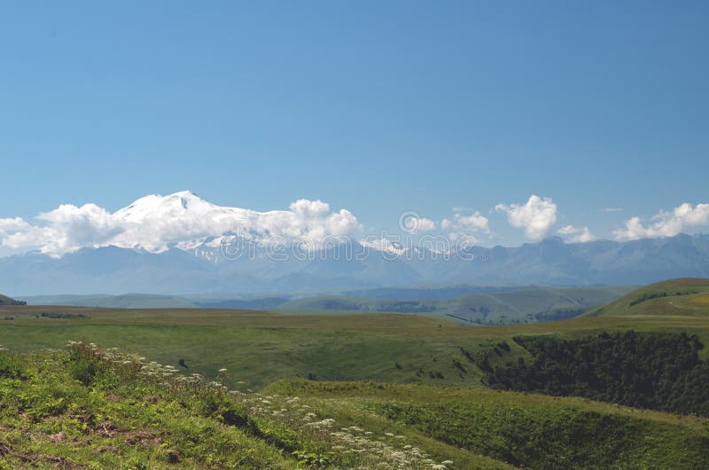 Beautiful Plain Landscape with Snowy Mountains in the Distance Stock ...