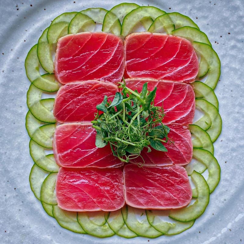 Beautiful Platter of Sashimi Tuna with Cucumber Slices Stock Photo ...