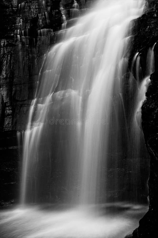 Powerful Waterfall Flowing Down Cliff Ledge Stock Photo - Image of ...